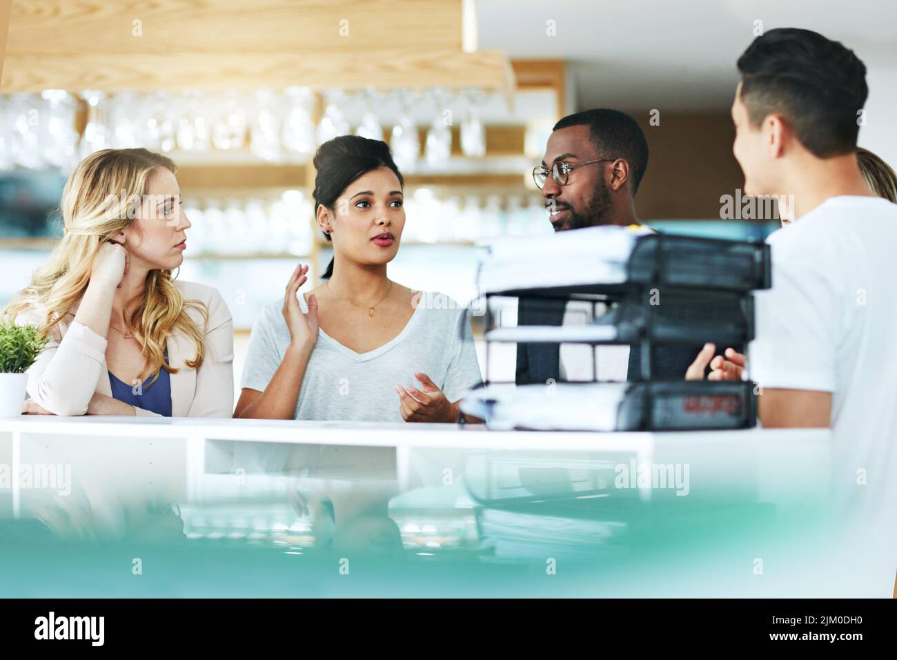 Diverse, listening and focused businesspeople in meeting talking ...