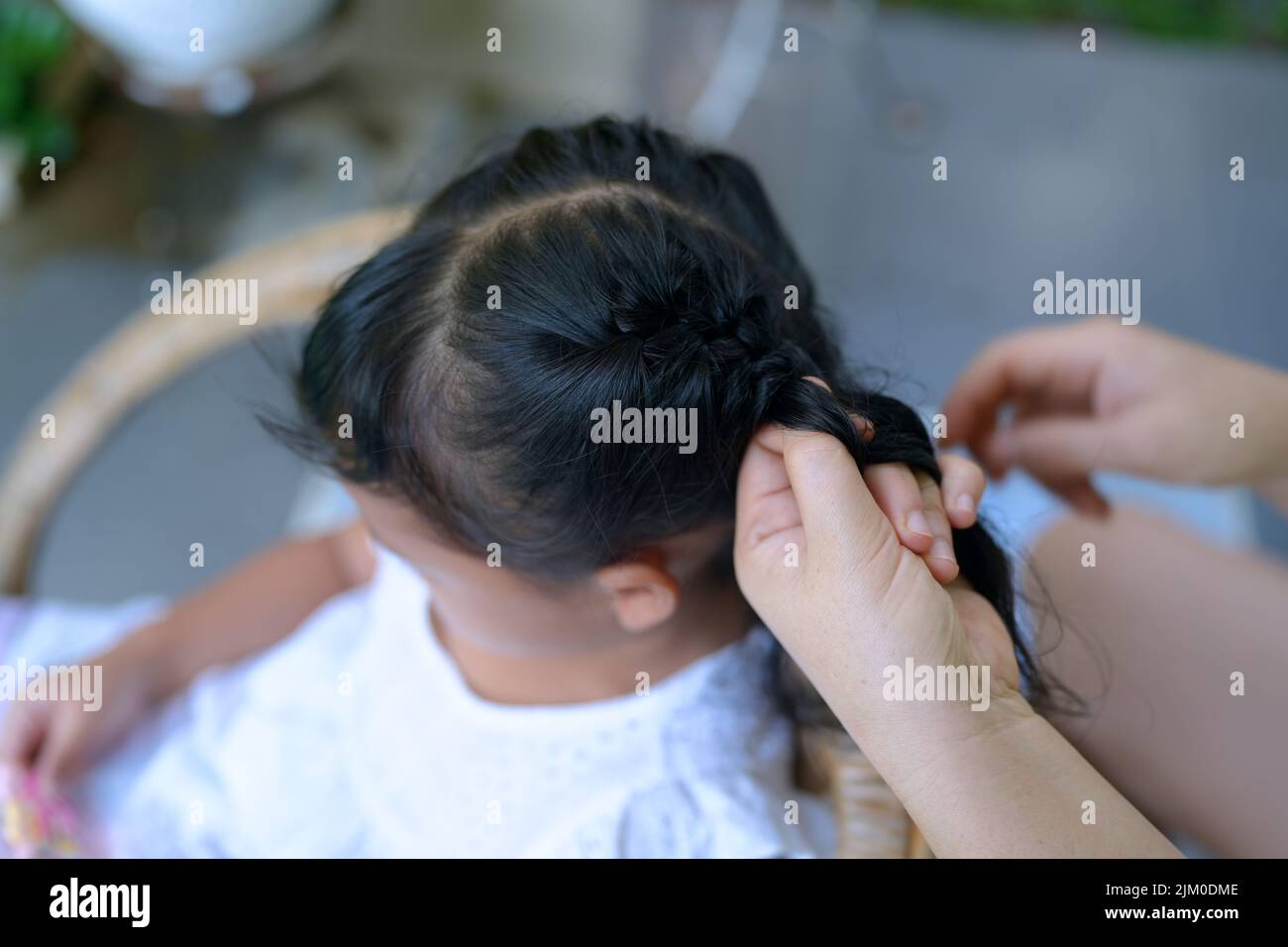 Mother plaiting daughter hair hi-res stock photography and images - Alamy