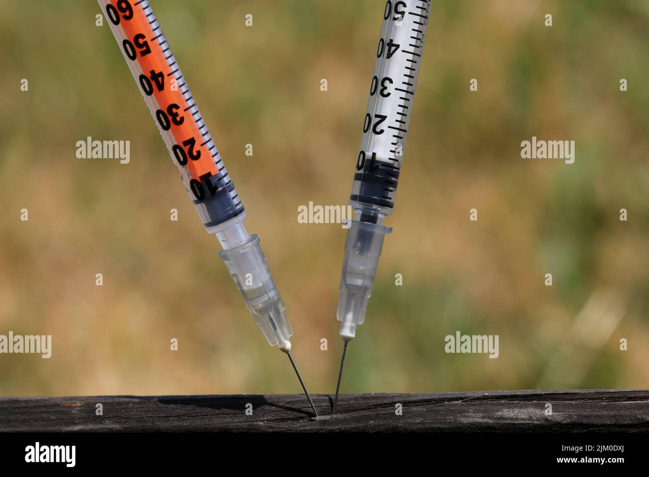 two abandoned syringes used by drug addicts to inject drugs Stock Photo ...