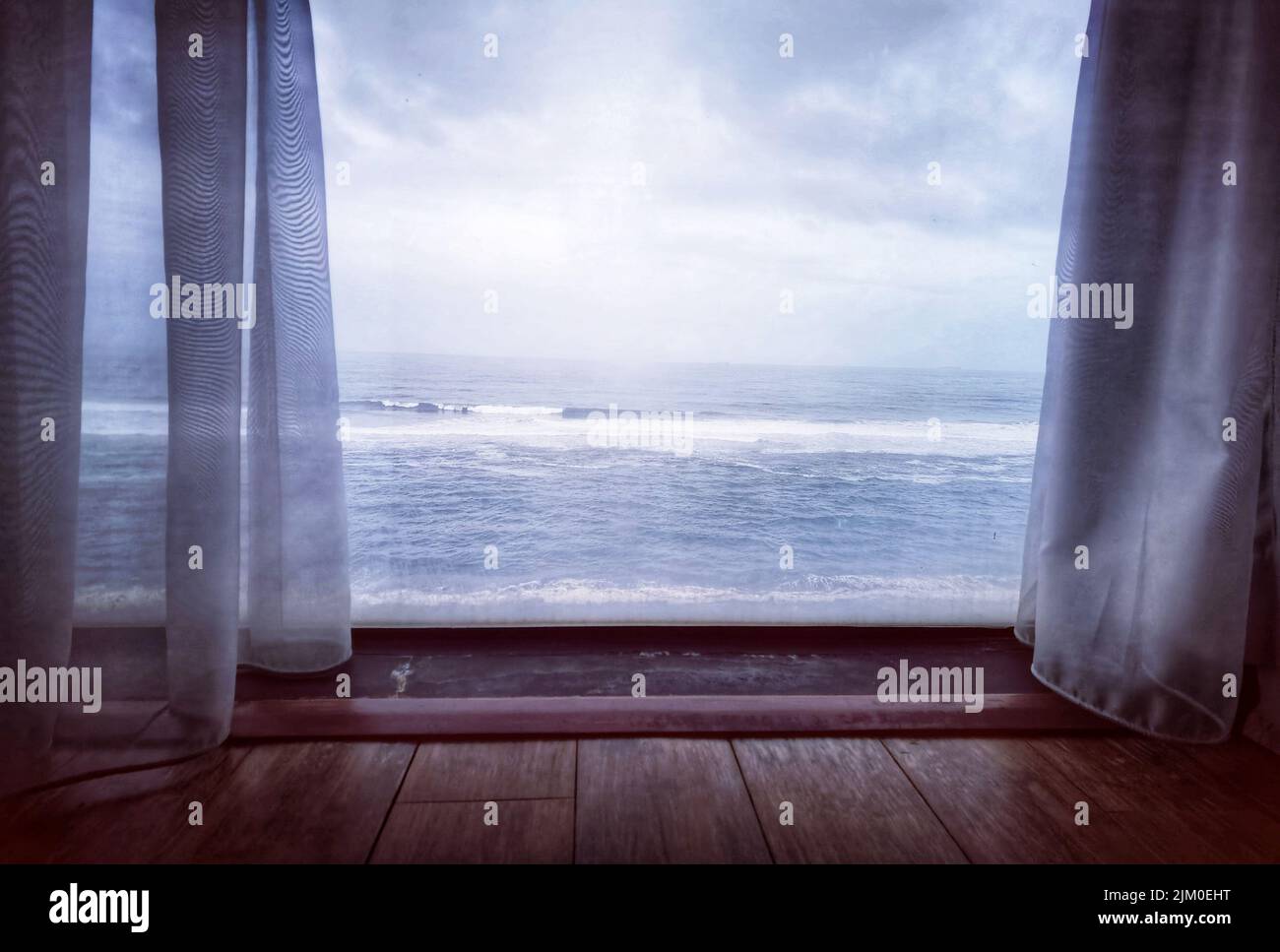 The view of the blue sea from a hotel or a cabin window. Relaxed ...