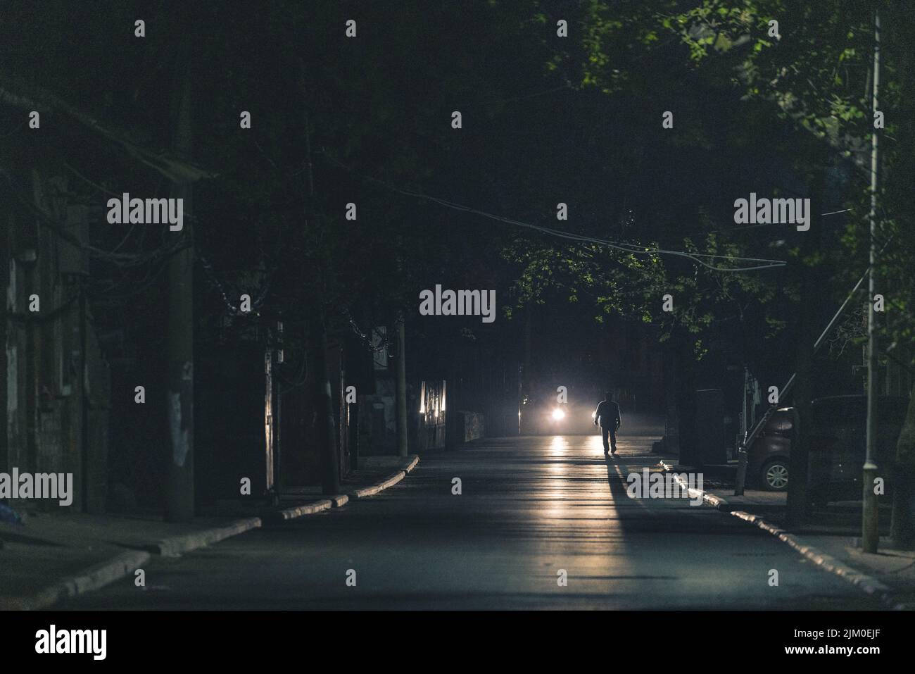 Man urban dark road hi-res stock photography and images - Alamy