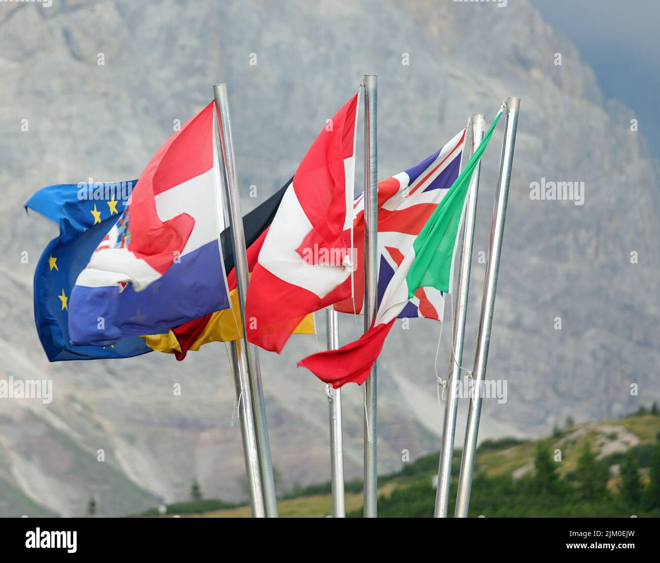 many international flags of nations waving intentional blur and ...
