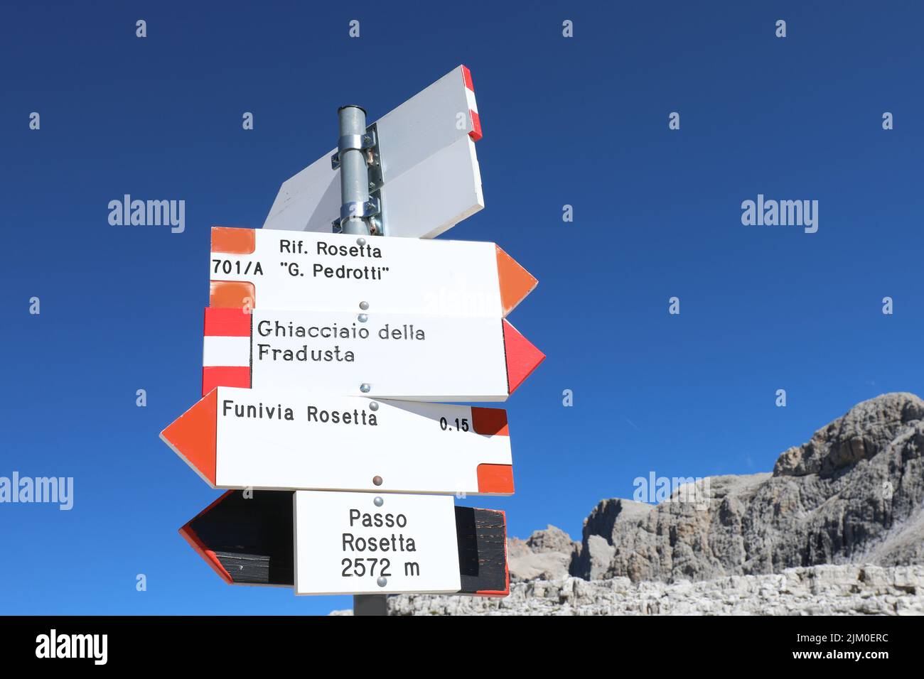 sign with arrows and directions to reach various places and shelters in ...