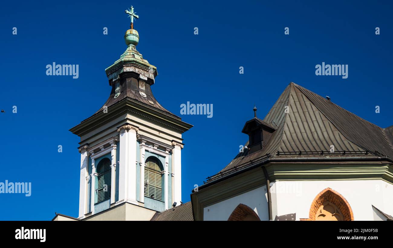 A catholic church tower under a blue sky Stock Photo - Alamy