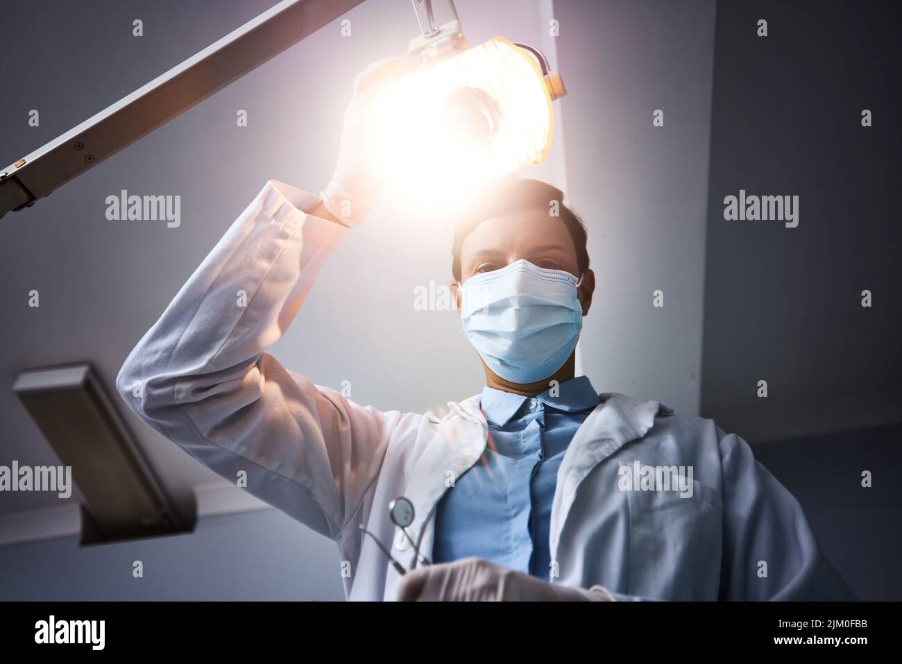 Shining the spotlight on dental health. Low angle shot of a dentist ...