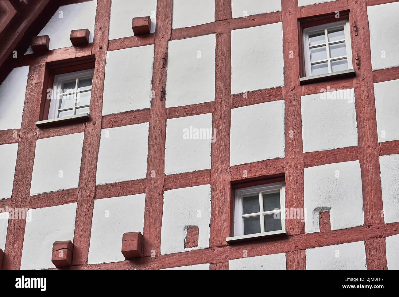A closeup shot of the house windows with red lines in Monreal, Eifel ...