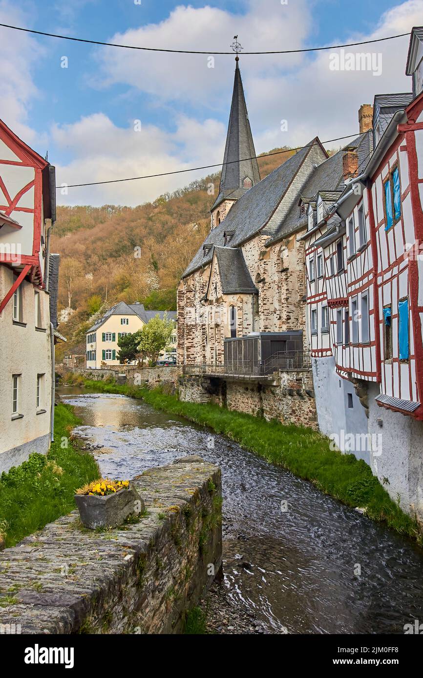 A lake separating buildings in Monreal, Eifel region, Germany Stock ...