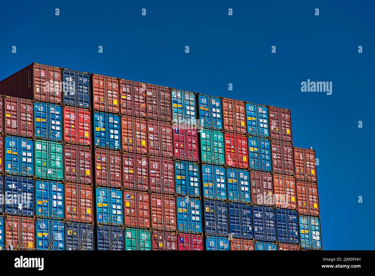 A stack of shipping containers at the port of Oakland in San Francisco ...