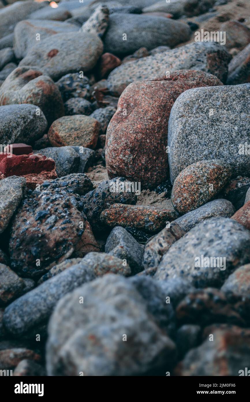A beautiful vertical shot of gray and red pebbles stones, for ...