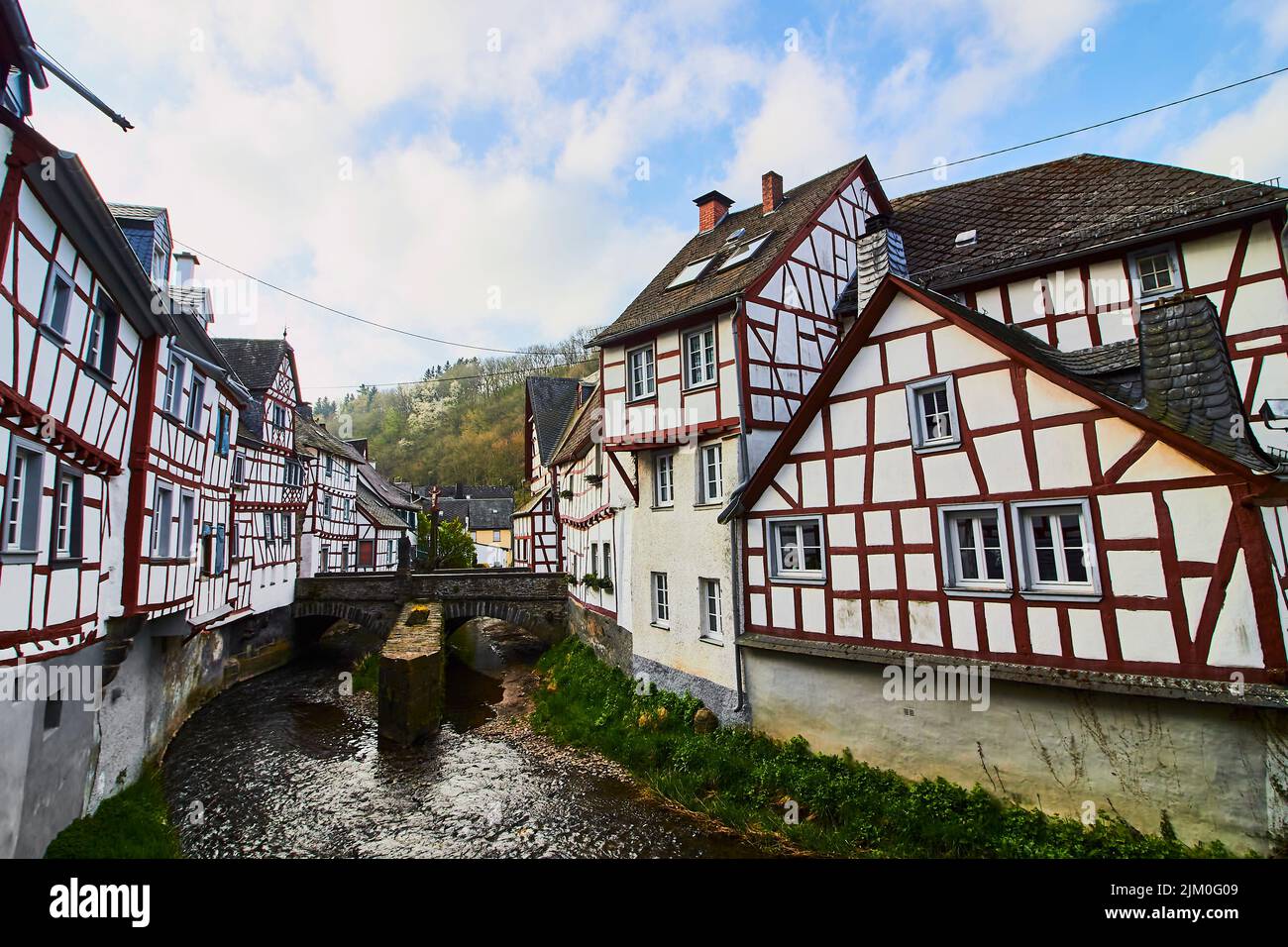 A lake separating buildings in Monreal, Eifel region, Germany Stock ...