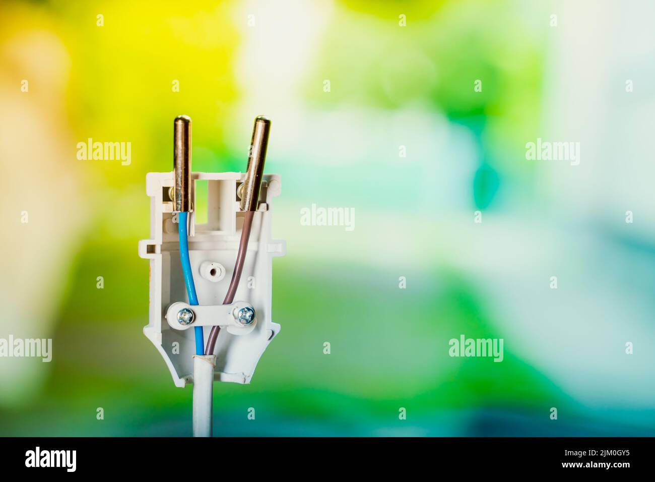 Connecting the wires of an electrical appliance into an electrical plug ...