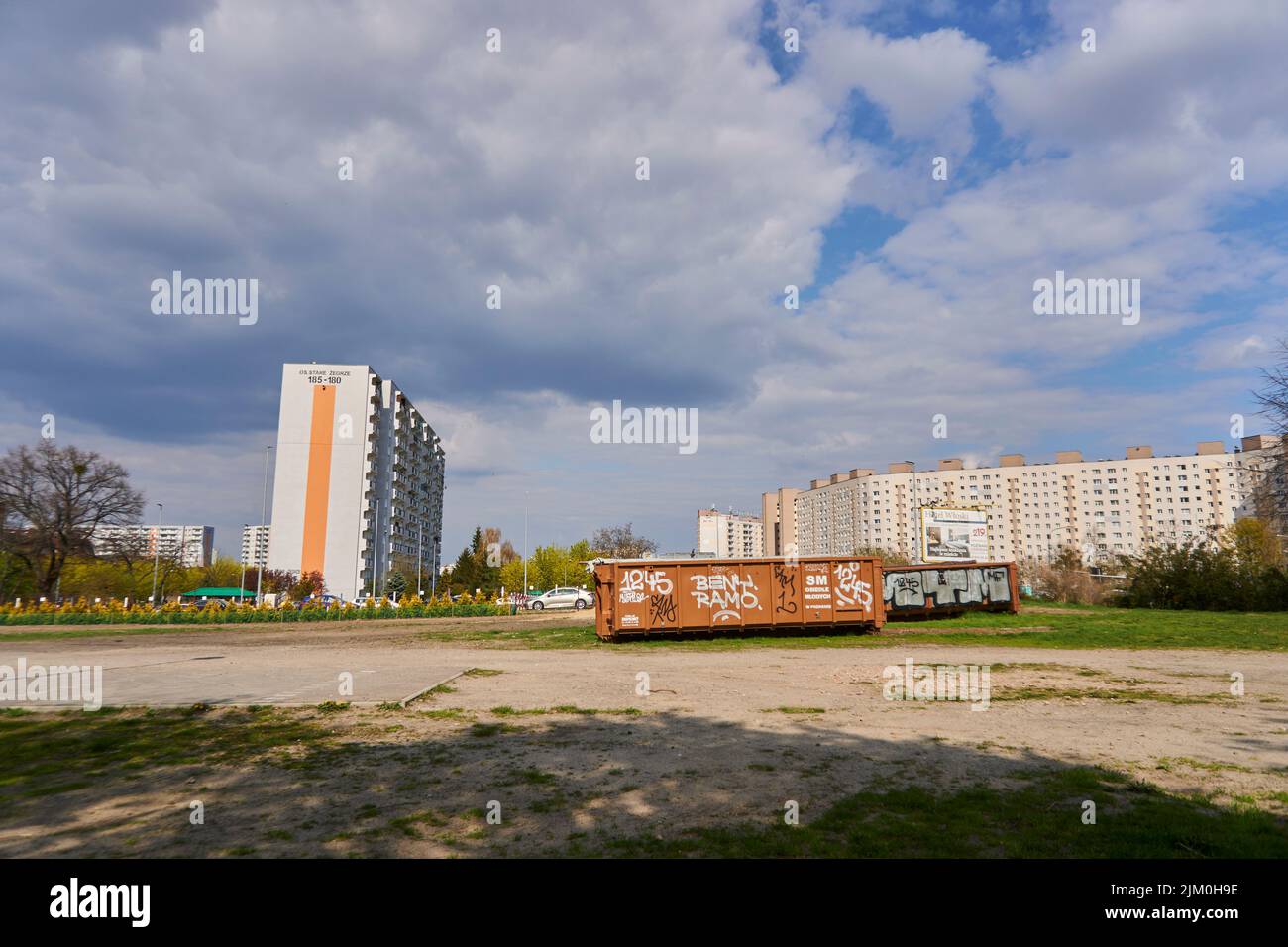 An area with a waste container close by apartment buildings in Poznan ...