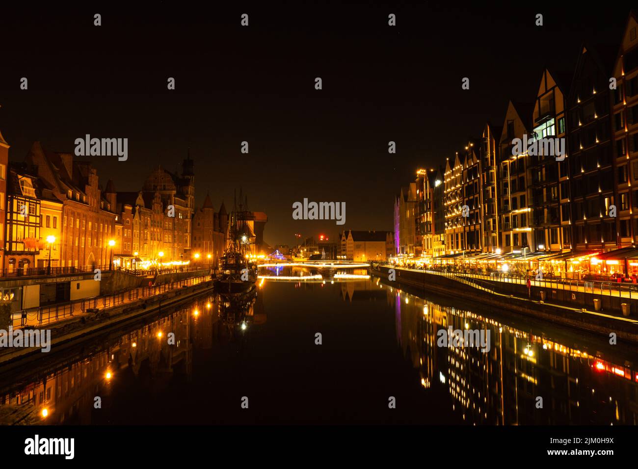 Old town in Gdansk at night. The riverside on Granary Island reflection ...