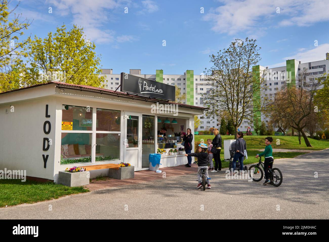 The adults and children ordering ice cream from the Pastelowa stand in ...