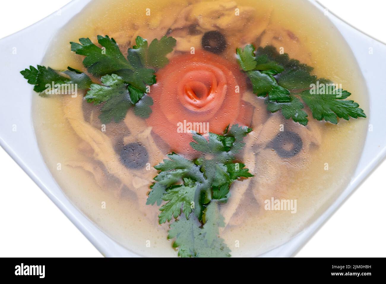 Chicken kholodets is decorated with parsley. Aspic jellied meat with ...