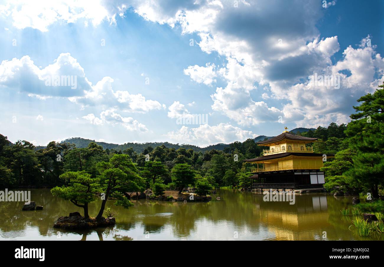 A pagoda on a pond bay surrounded by trees in Japan Stock Photo - Alamy