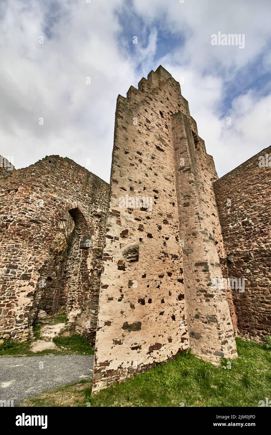 A vertical shot of the Ruins tower of the Lowenburg castle in Monreal ...