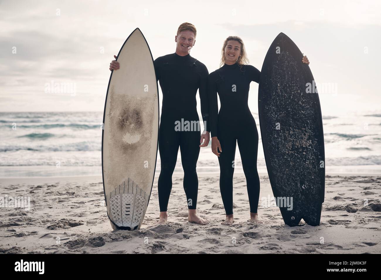 Two women surfboards on beach hi-res stock photography and images - Alamy
