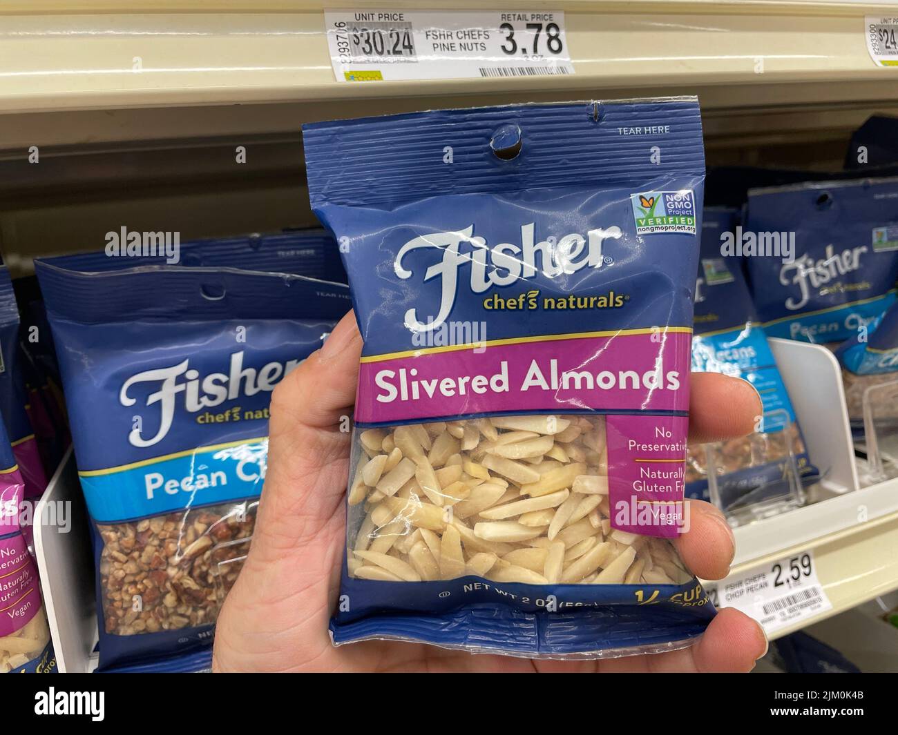 Augusta, Ga USA - 04 15 22: Hand holding Fisher bagged nuts Slivered ...