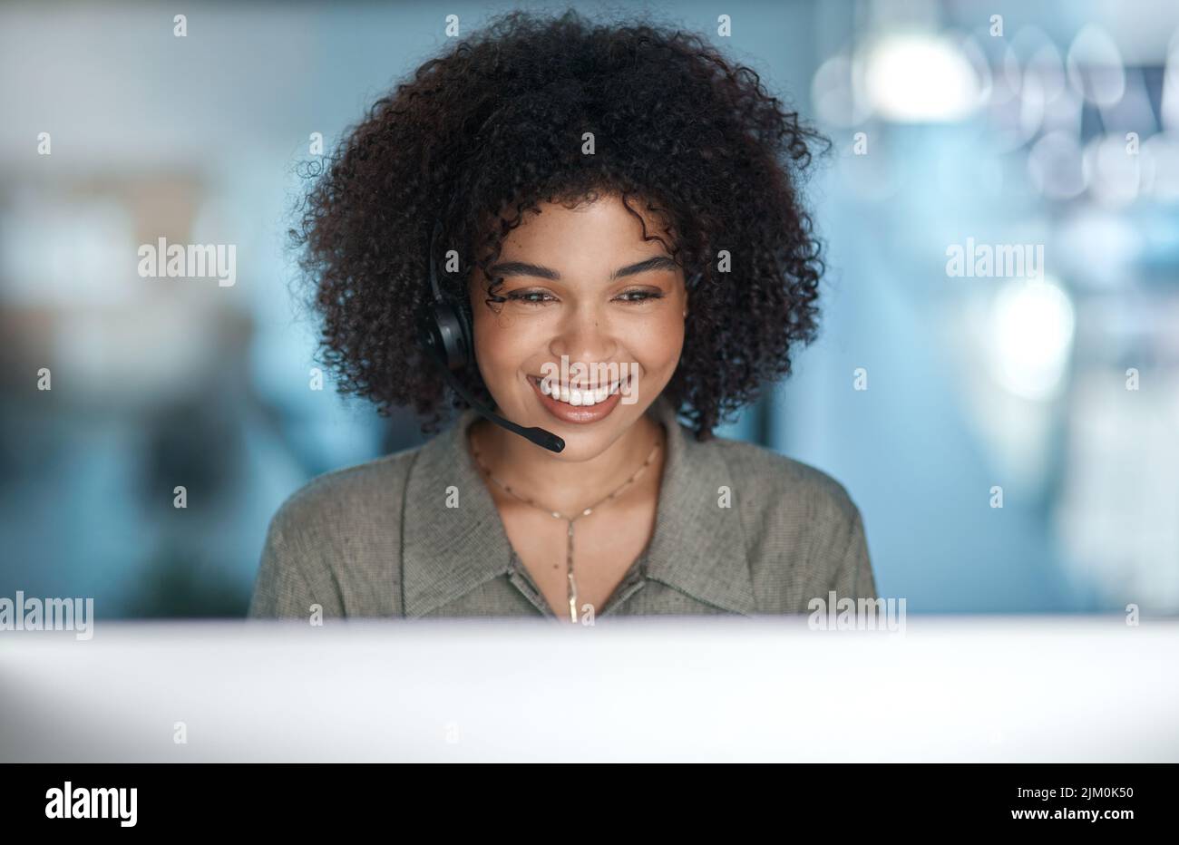 Use youre smile to change the world. a young female agent smiling over ...