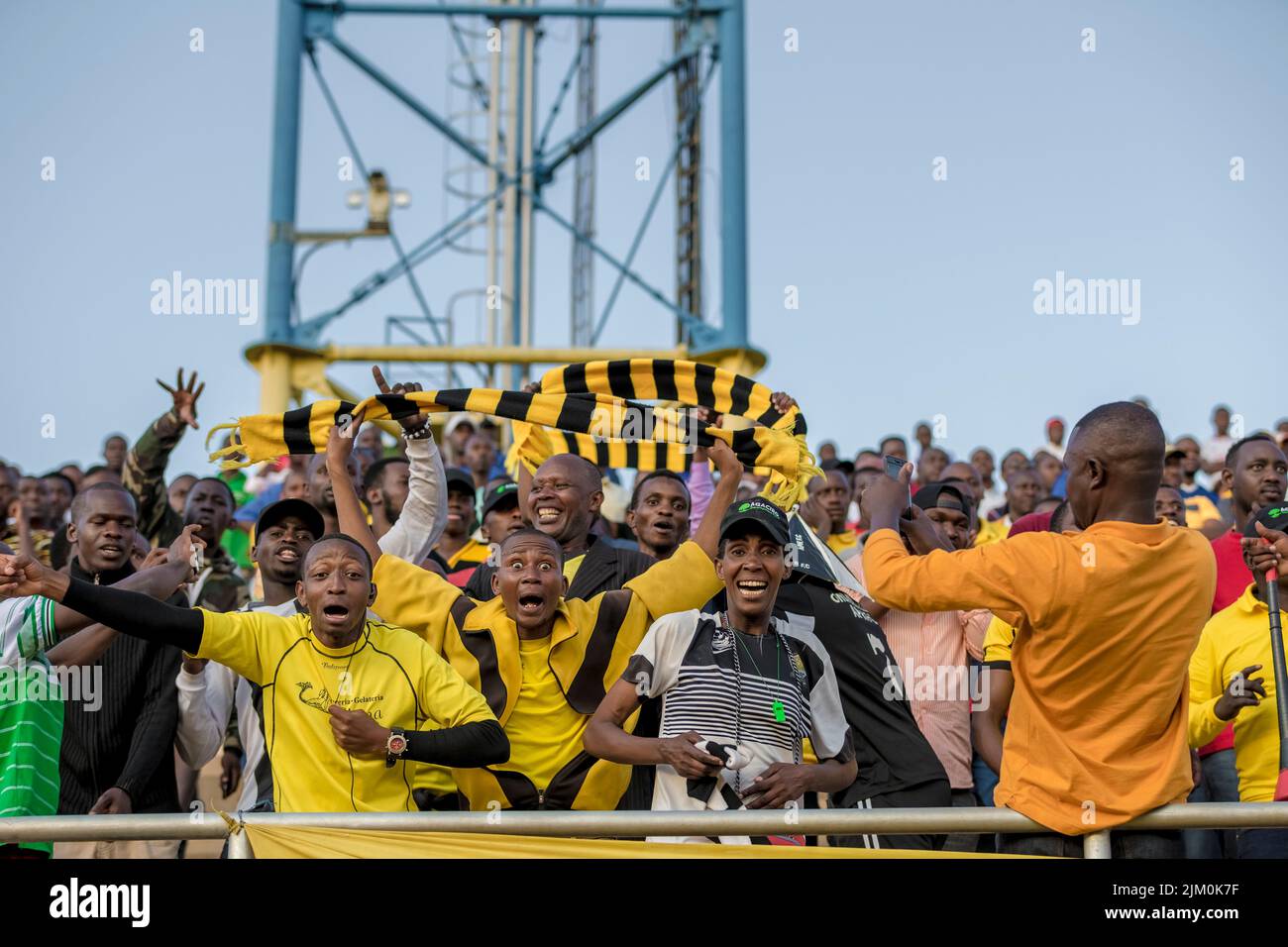 A bright morning outdoors at a football game stadium in Rwanda with ...