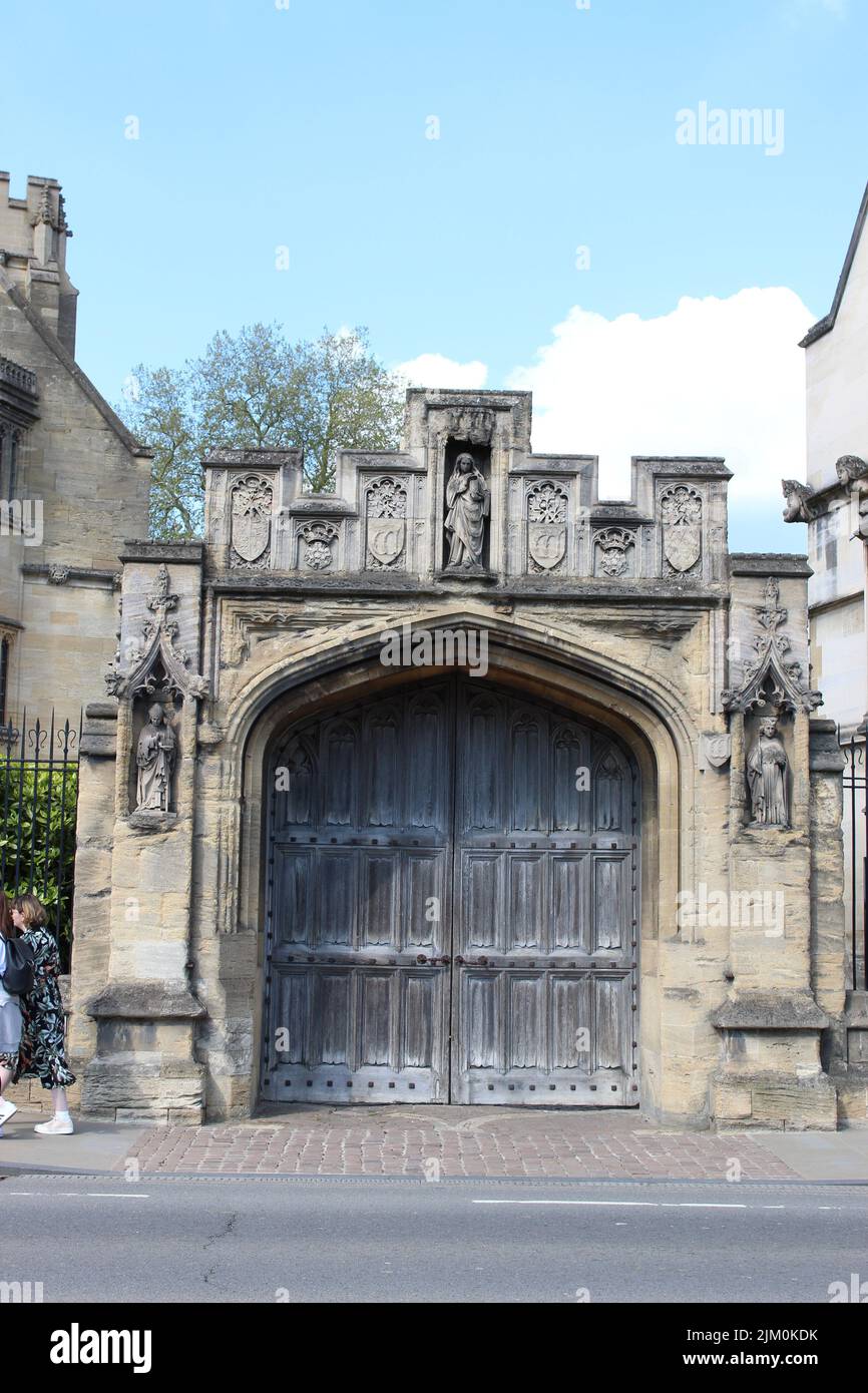 A vertical shot of Oxford Christ church cathedral gates surrounded by ...