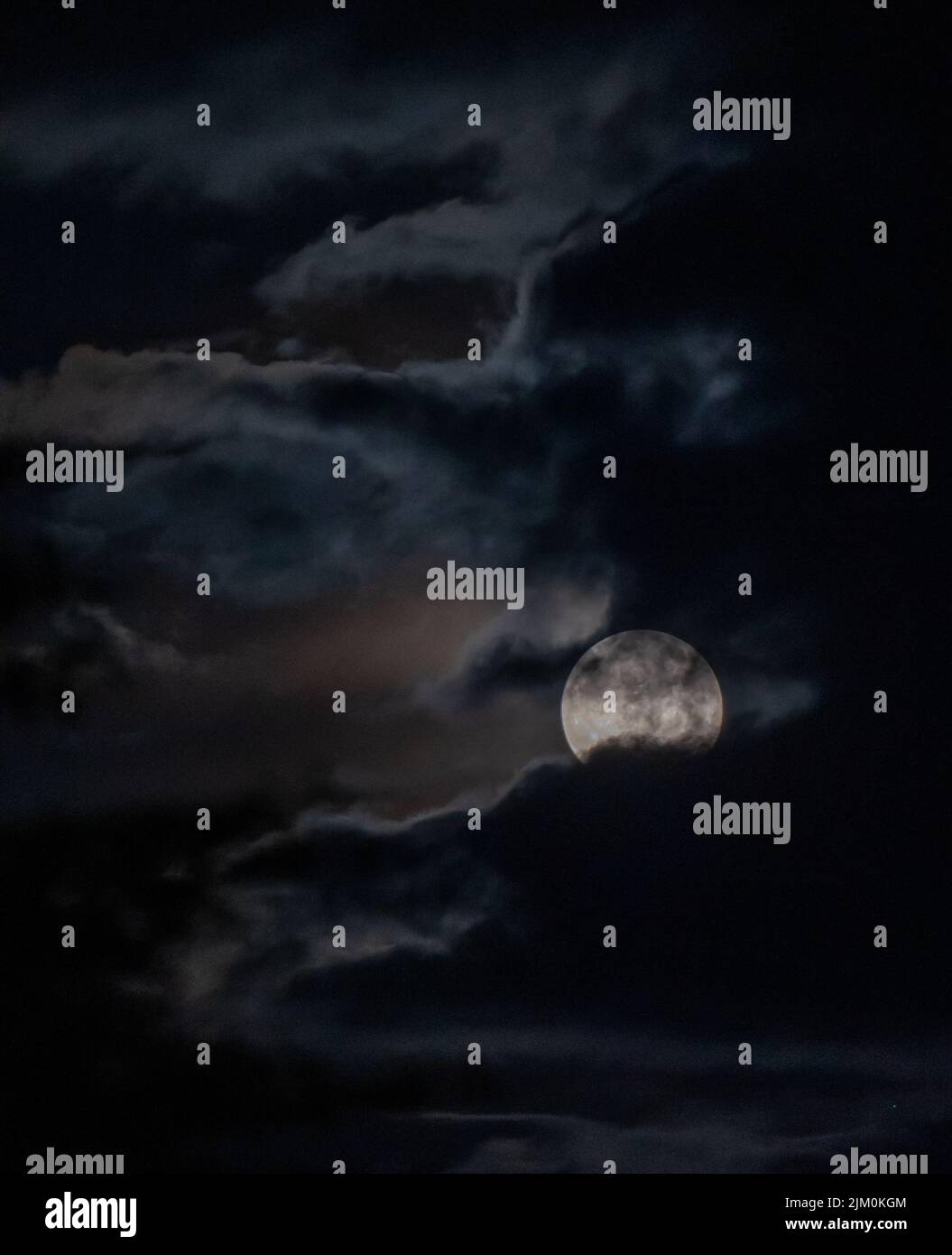 Vertical cloudy moon hi-res stock photography and images - Alamy