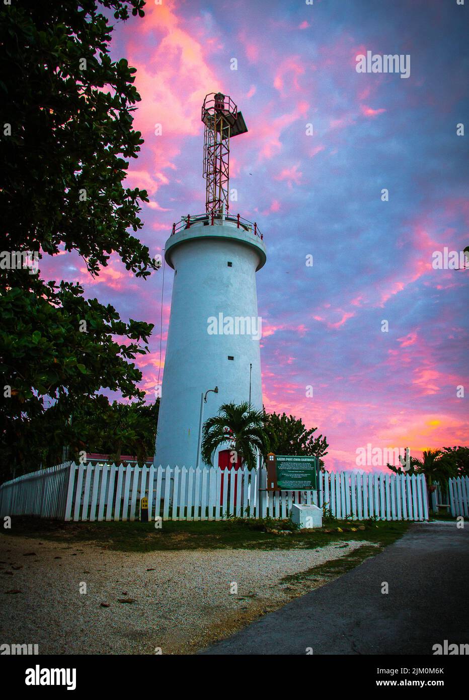 A vertical shot of the Galera Point Lighthouse against a purple-pink ...