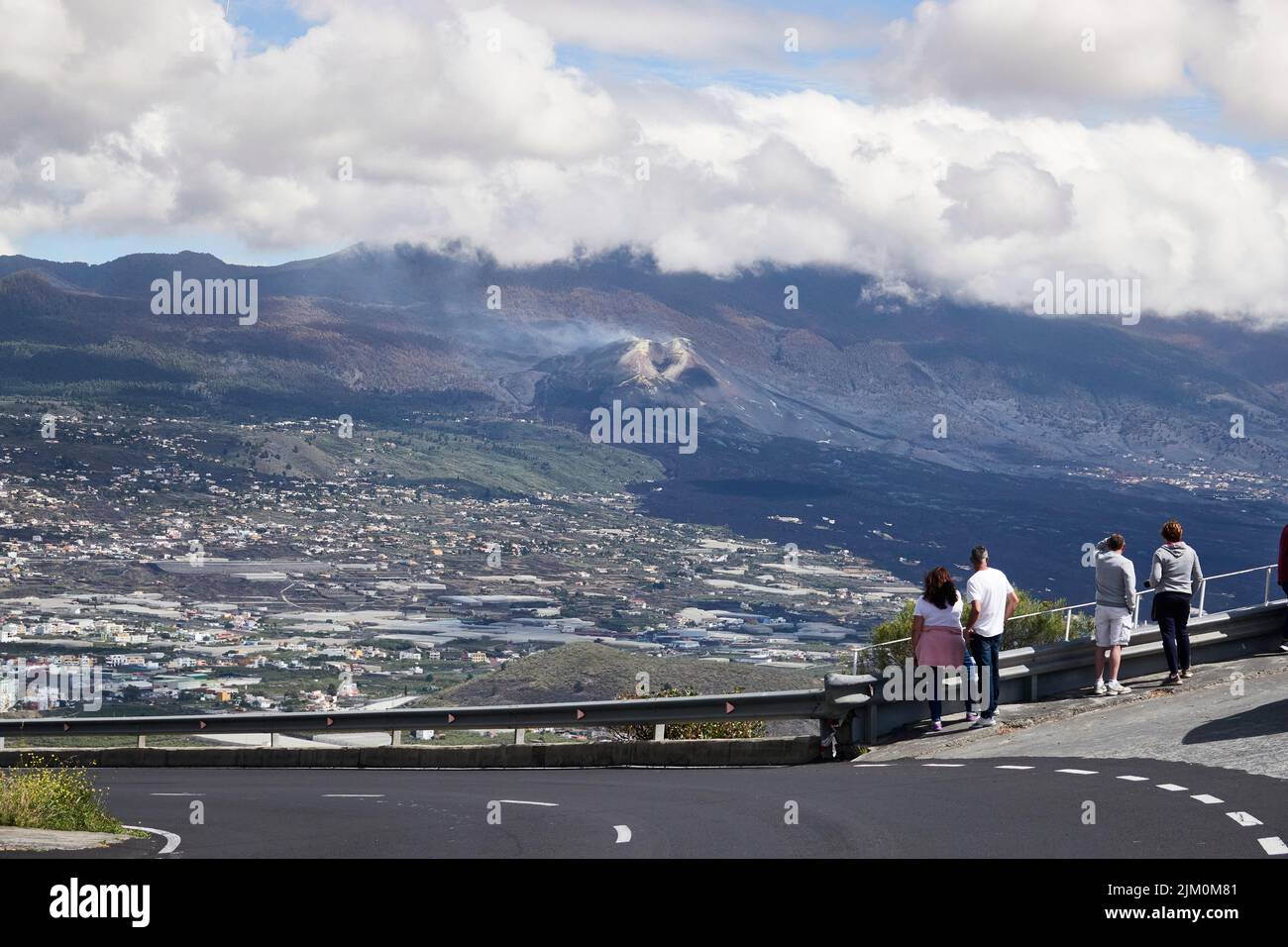 The tourists standing and observing a small Tazacorte town view in ...