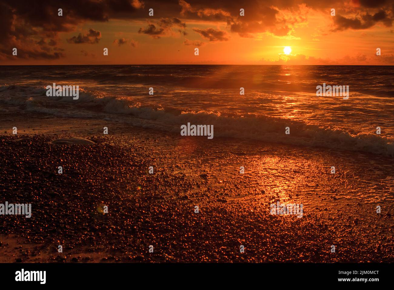 A mesmerizing shot of a sunset at the coast of Baltic sea Stock Photo ...