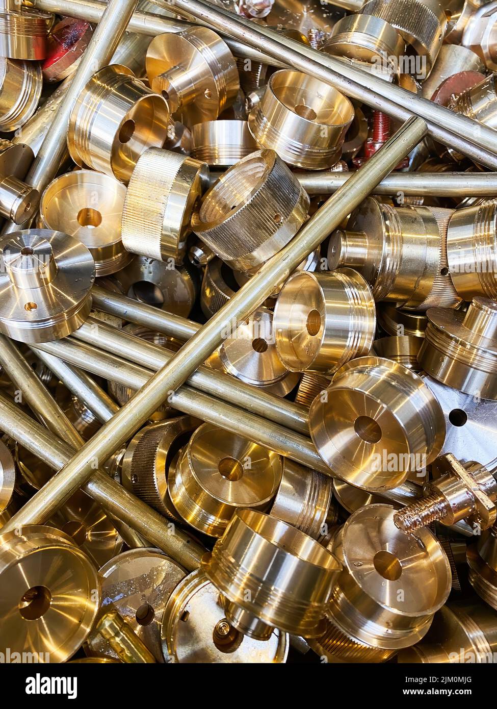 Brass scrap waste from manufacturing process, Portrait view. High ...