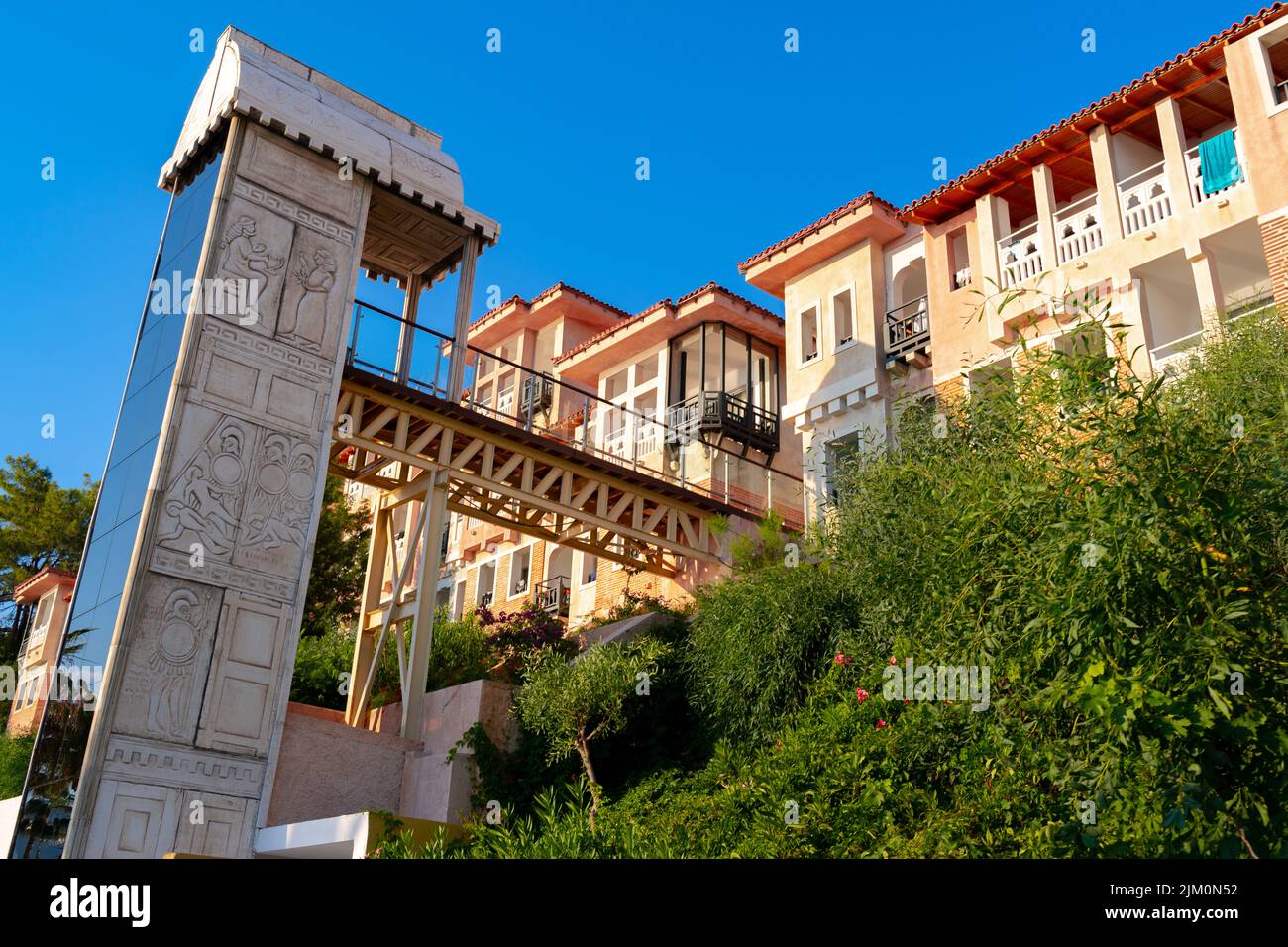 Stone facade of old residential building in greek style Stock Photo - Alamy