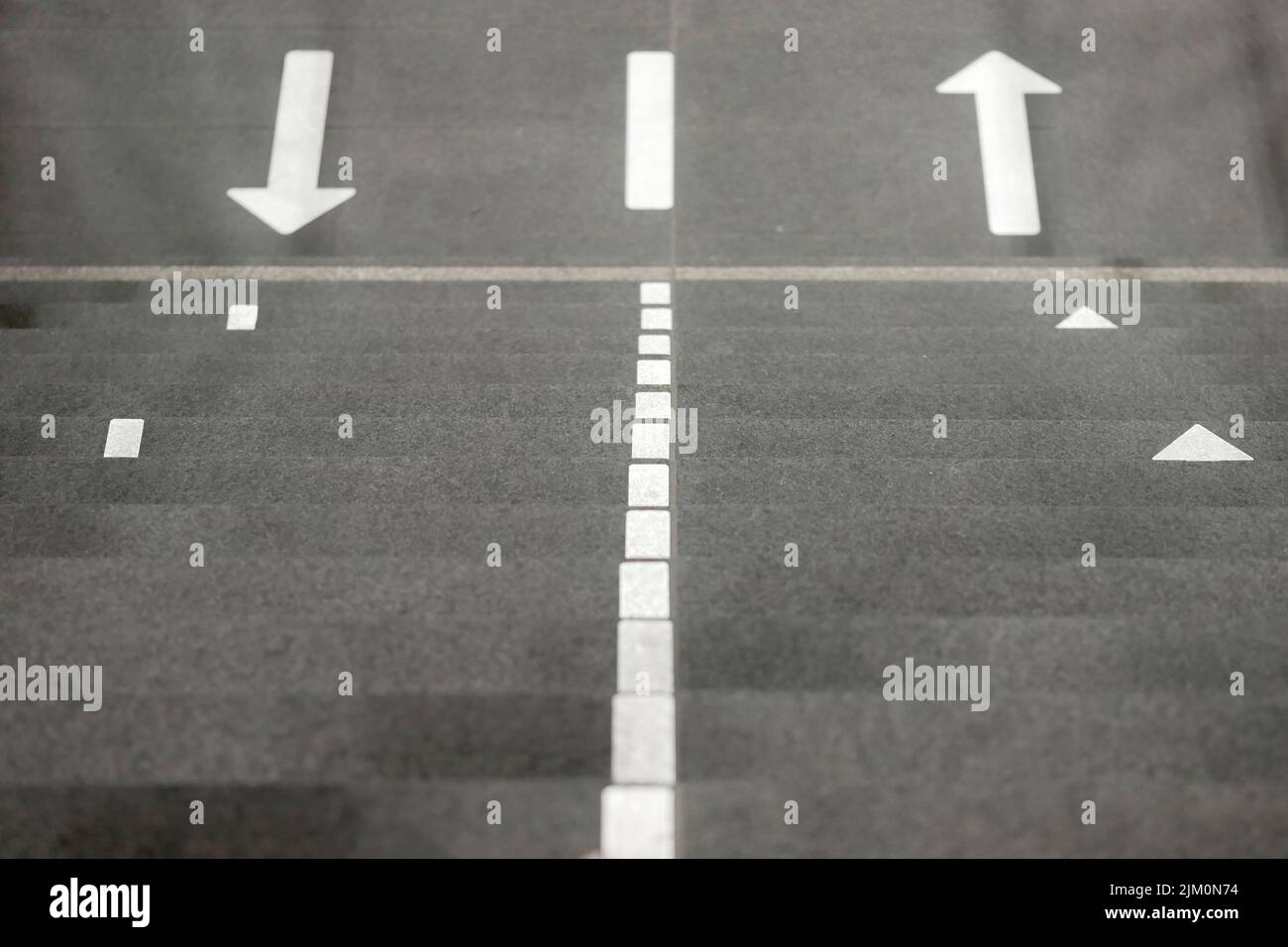 Separate upward downward lane on a stairway with signs and arrows Stock ...