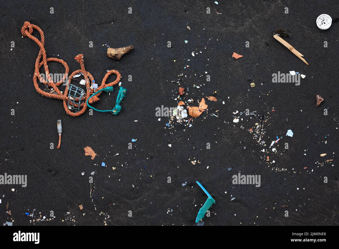 A top view of a polluted street with ropes and broken items Stock Photo ...