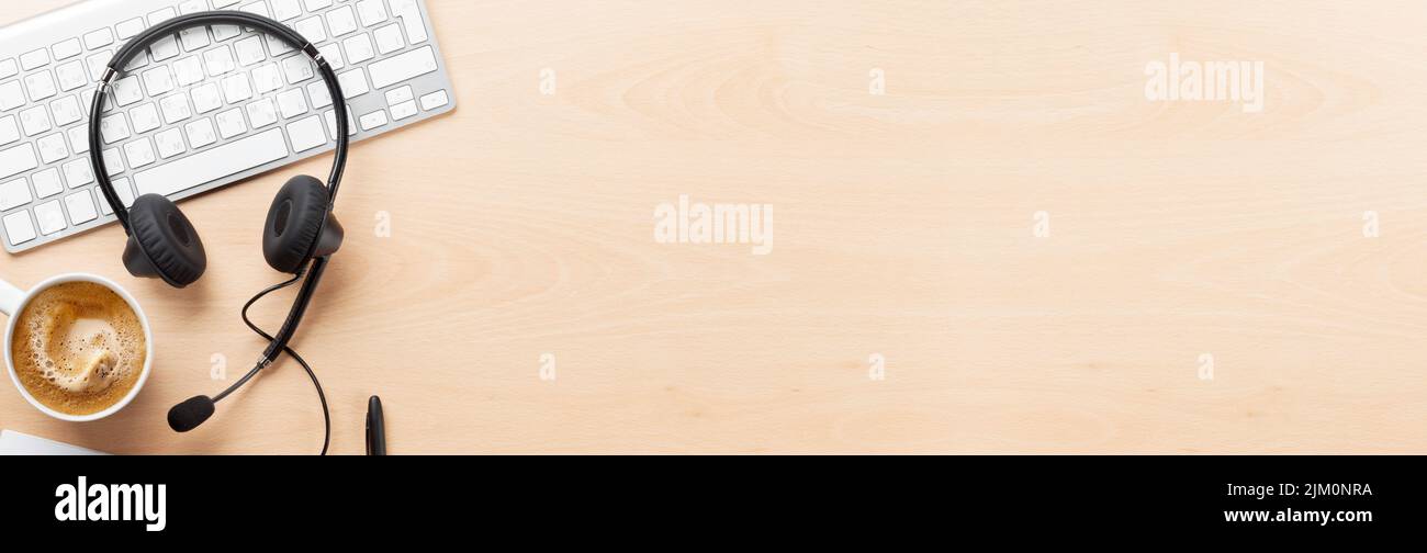 Office desk with headset and pc. Call center support table. Top veiw ...