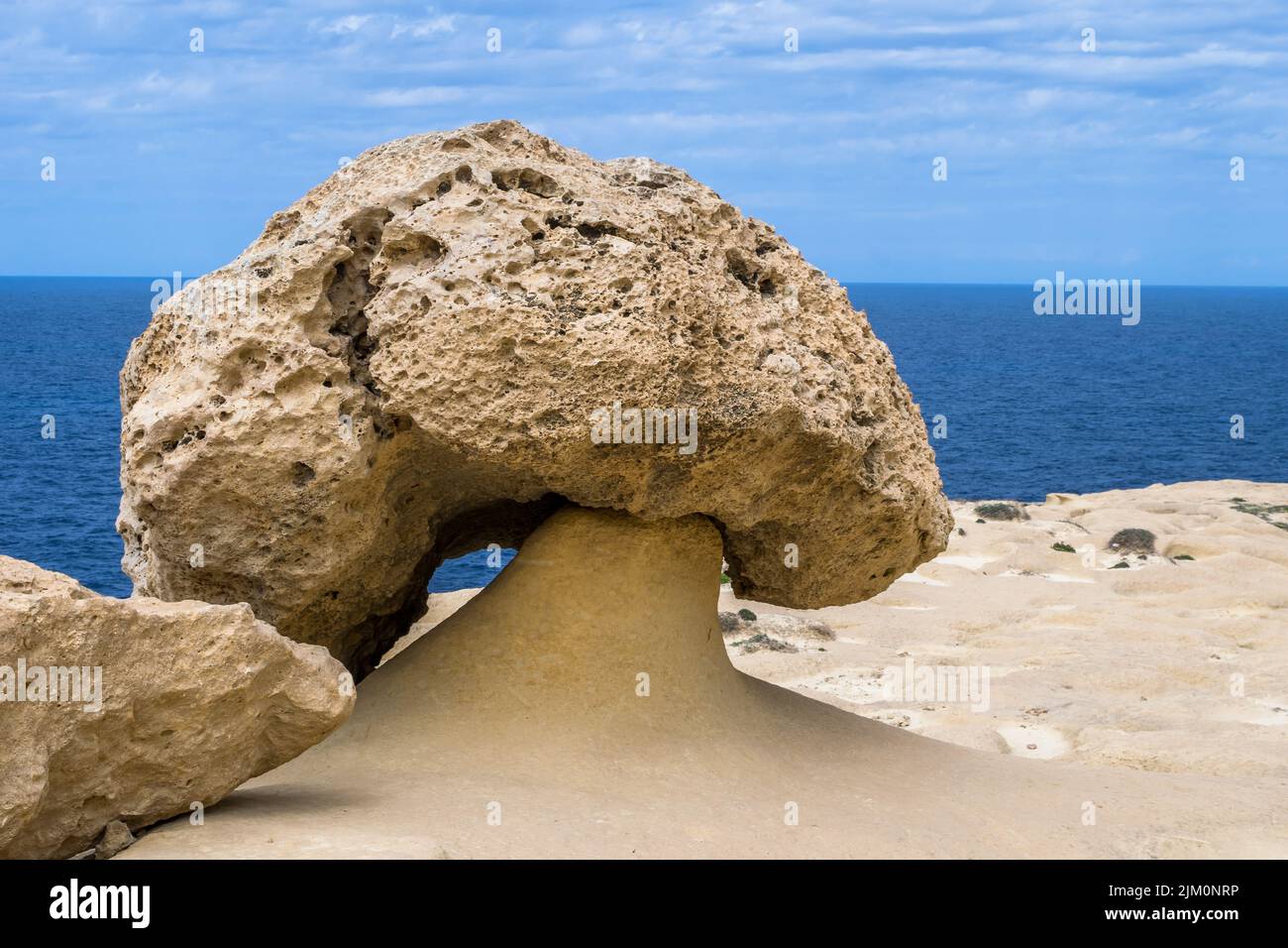 A mushroom shaped rock or rock pedestal, formed due to a soft and hard ...