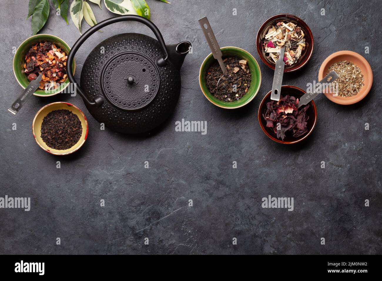 Various dried tea and teapot. Top view flat lay with copy space Stock ...