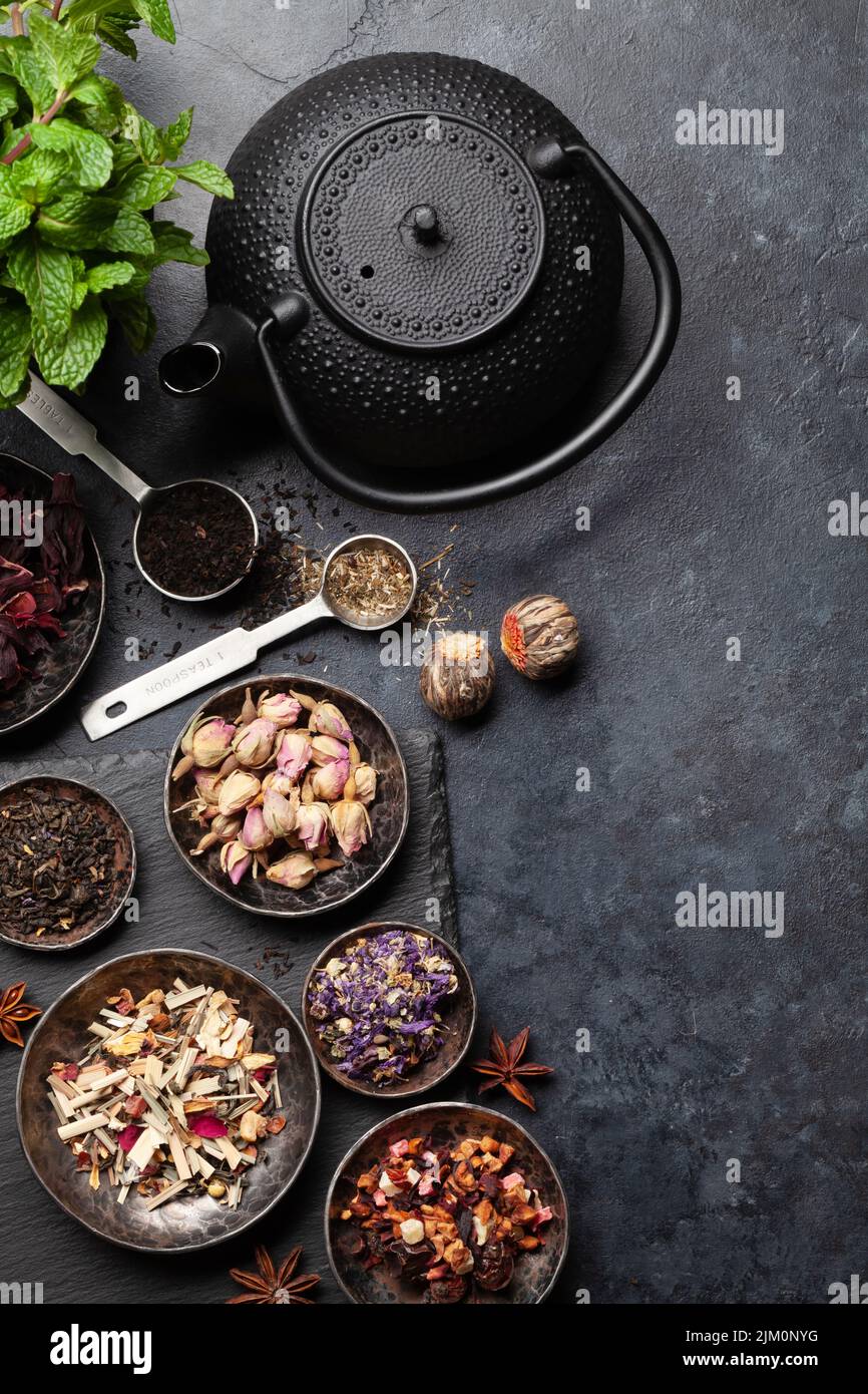 Various dried tea and teapot. Top view flat lay with copy space Stock ...