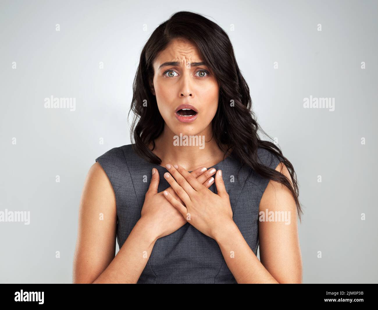 No one likes to hear bad news. a young woman looking surprised while ...
