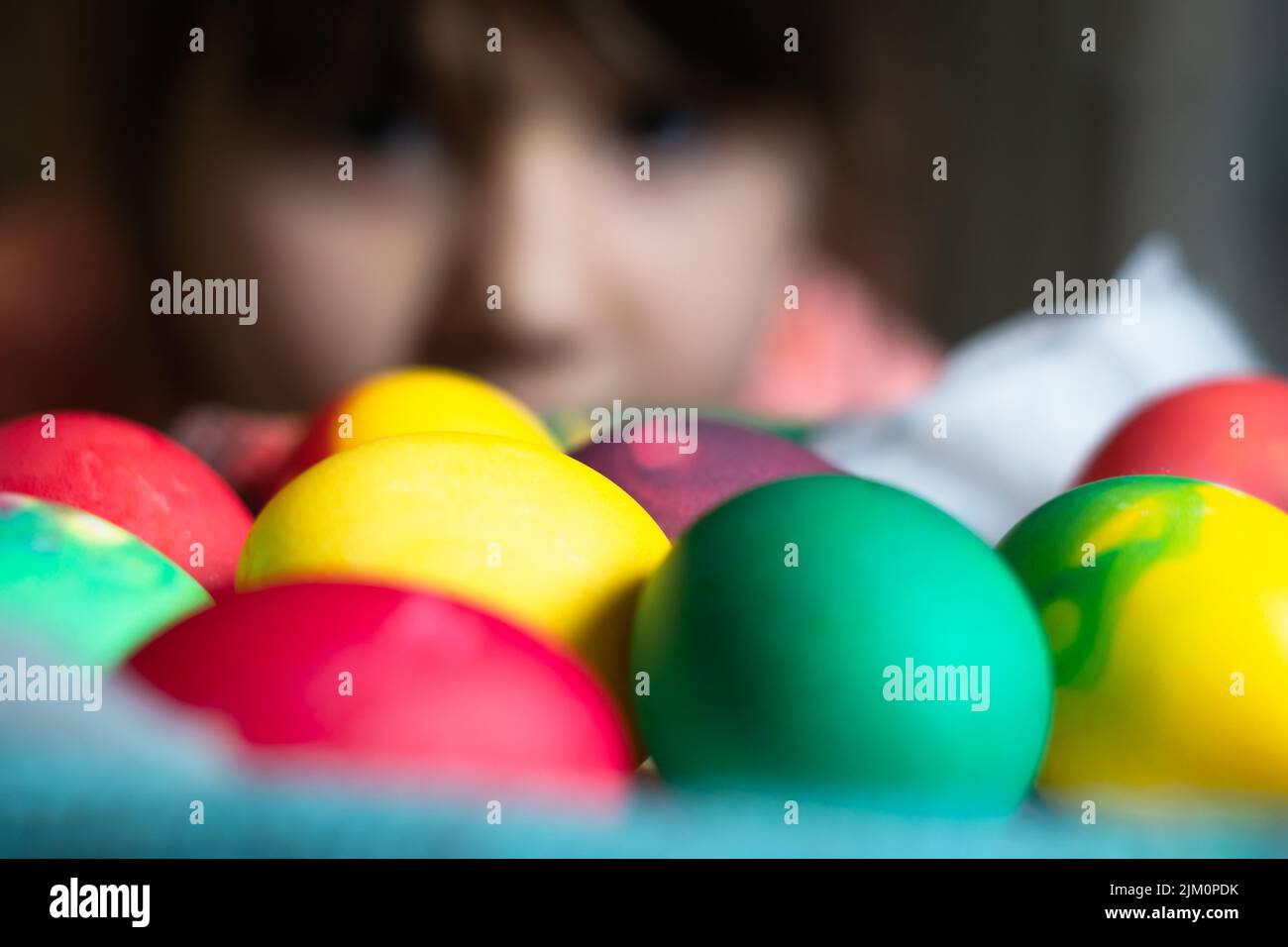 A close up little child with eggs Stock Photo - Alamy