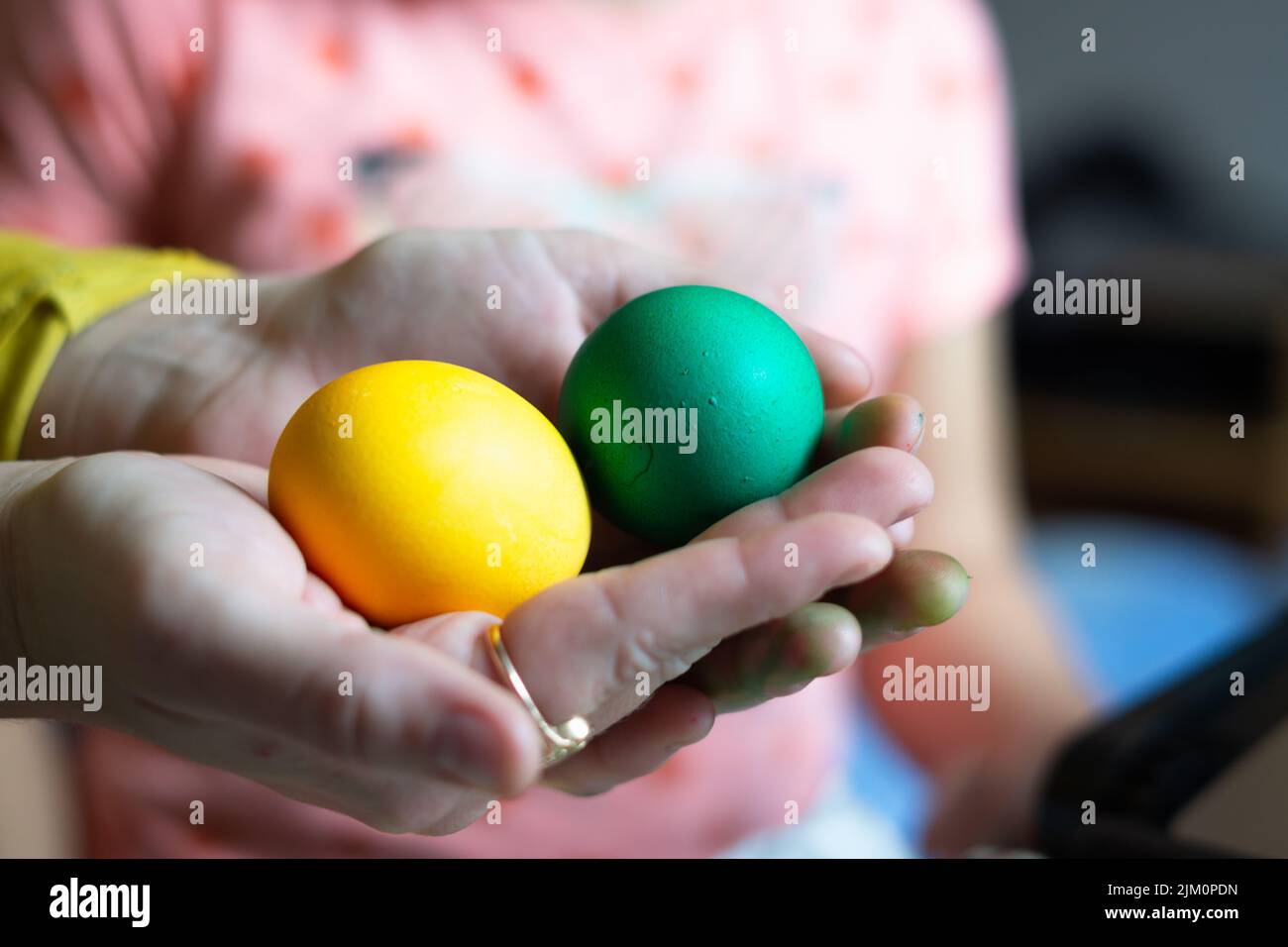 A close up easter eggs in hand Stock Photo - Alamy