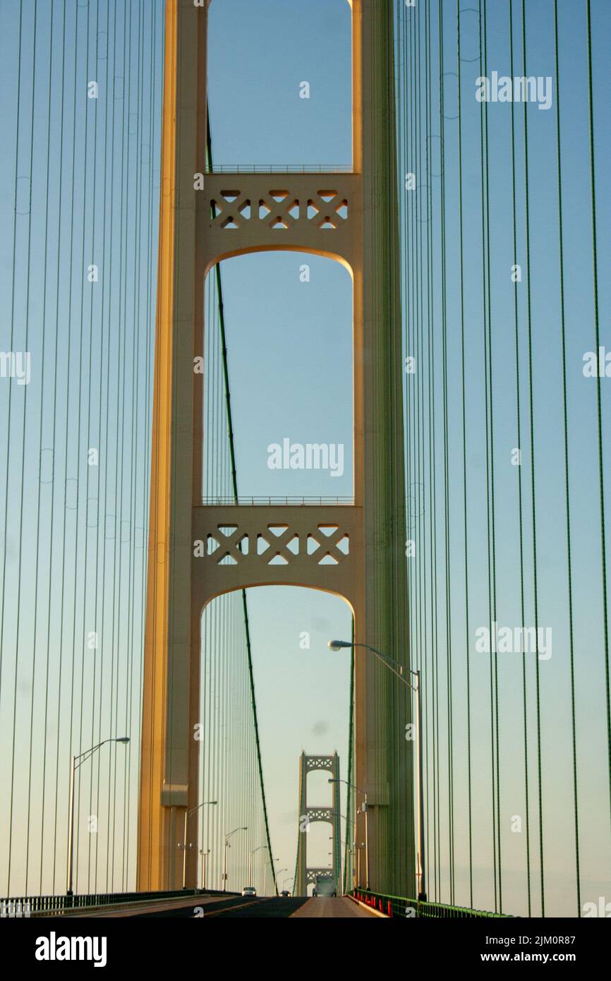 A vertical shot of Mackinac Bridge, suspension bridge spanning the ...