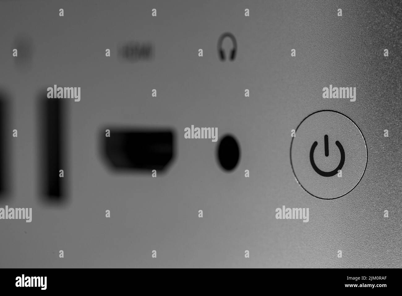 Focus on power button low key macro closeup still life of modern ...