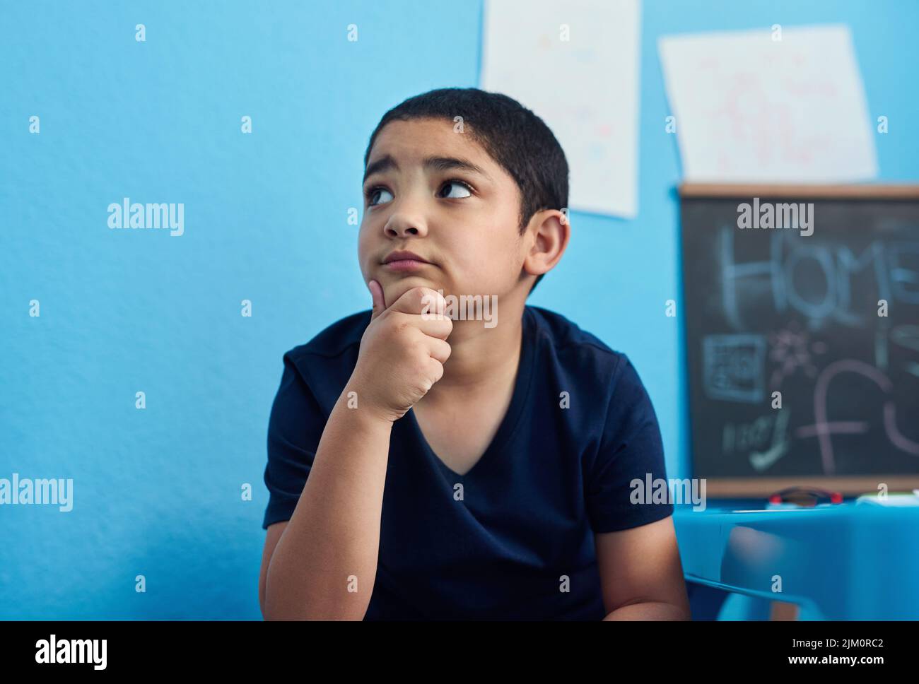 Now what was I thinking. an adorable little boy looking thoughtful ...