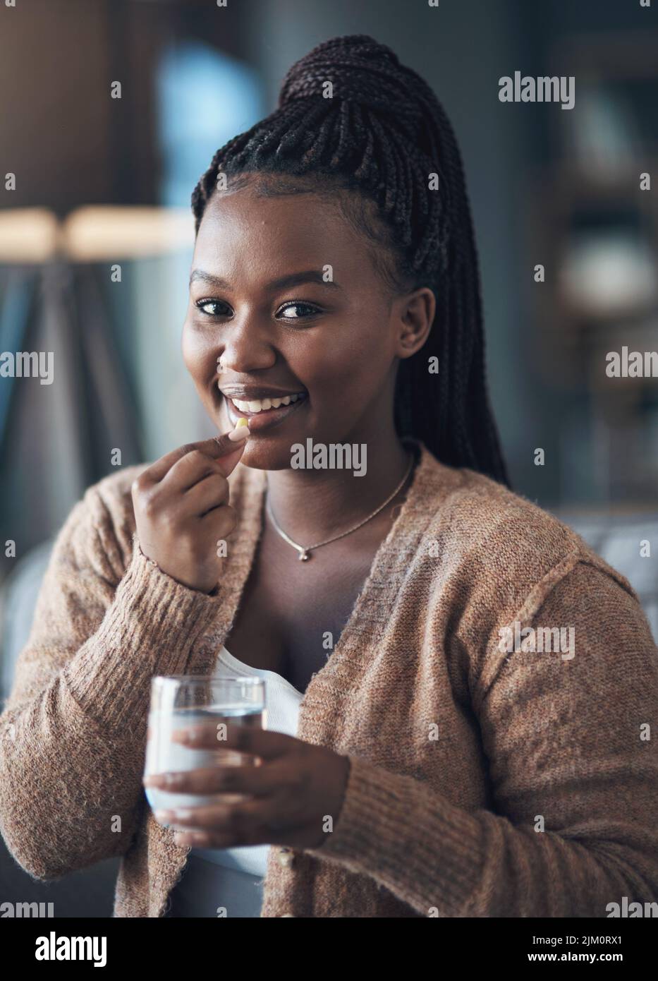 A healthy body is a healthy life. an attractive young woman sitting ...