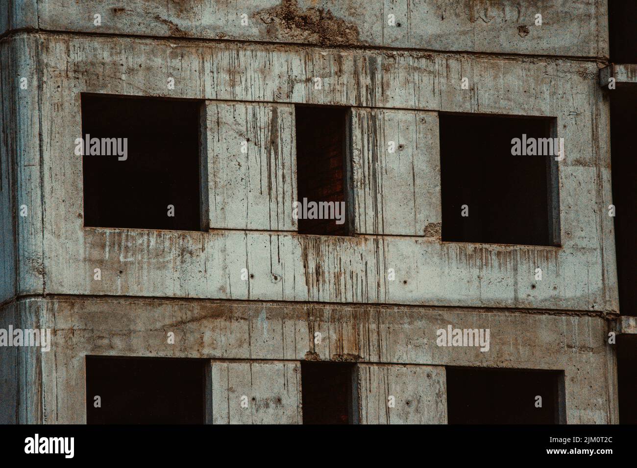 A rusted old creepy abandoned building with dirt on it Stock Photo - Alamy