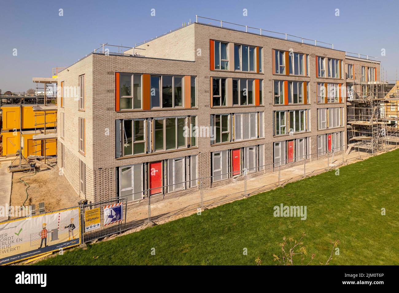 Final construction phase showing exterior facade aerial of real estate ...