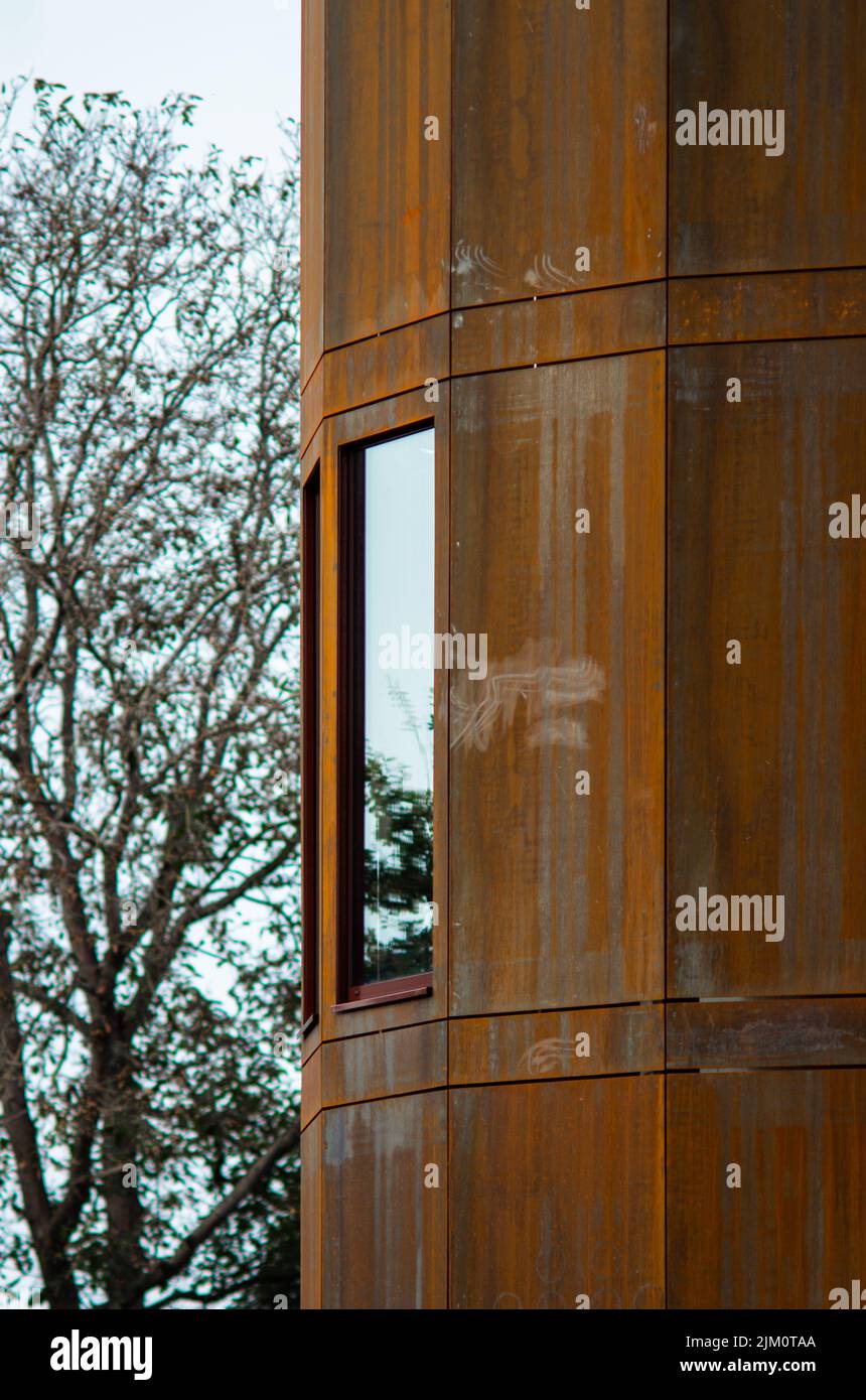 A vertical closeup of a rusty building exterior fragment Stock Photo ...