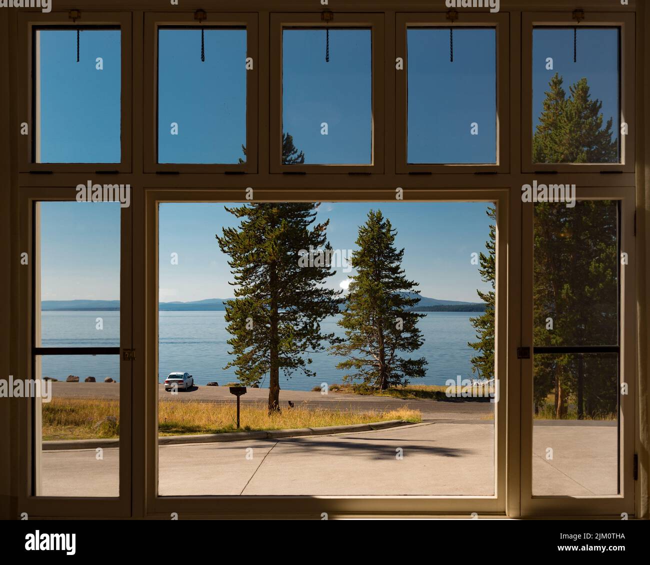 A beautiful view of a lake from the Yellowstone hotel lobby's window ...