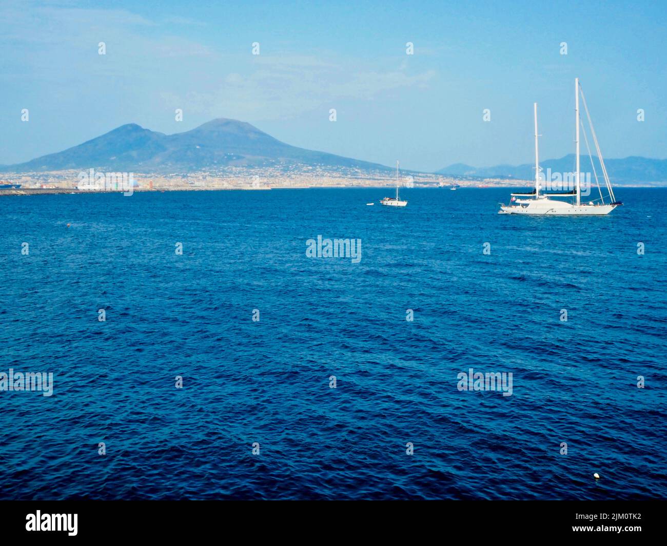 horizontal view of the gulf of naples, with sailing boats and the ...